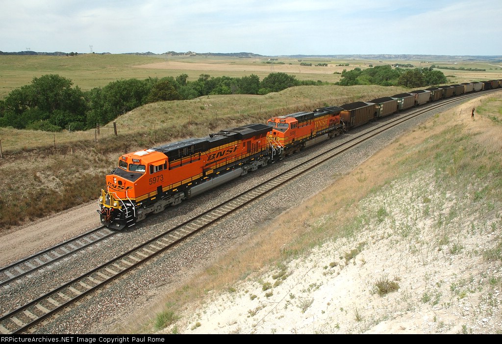 BNSF 5973 attacks the sand hills with a loaded eastbound coal train